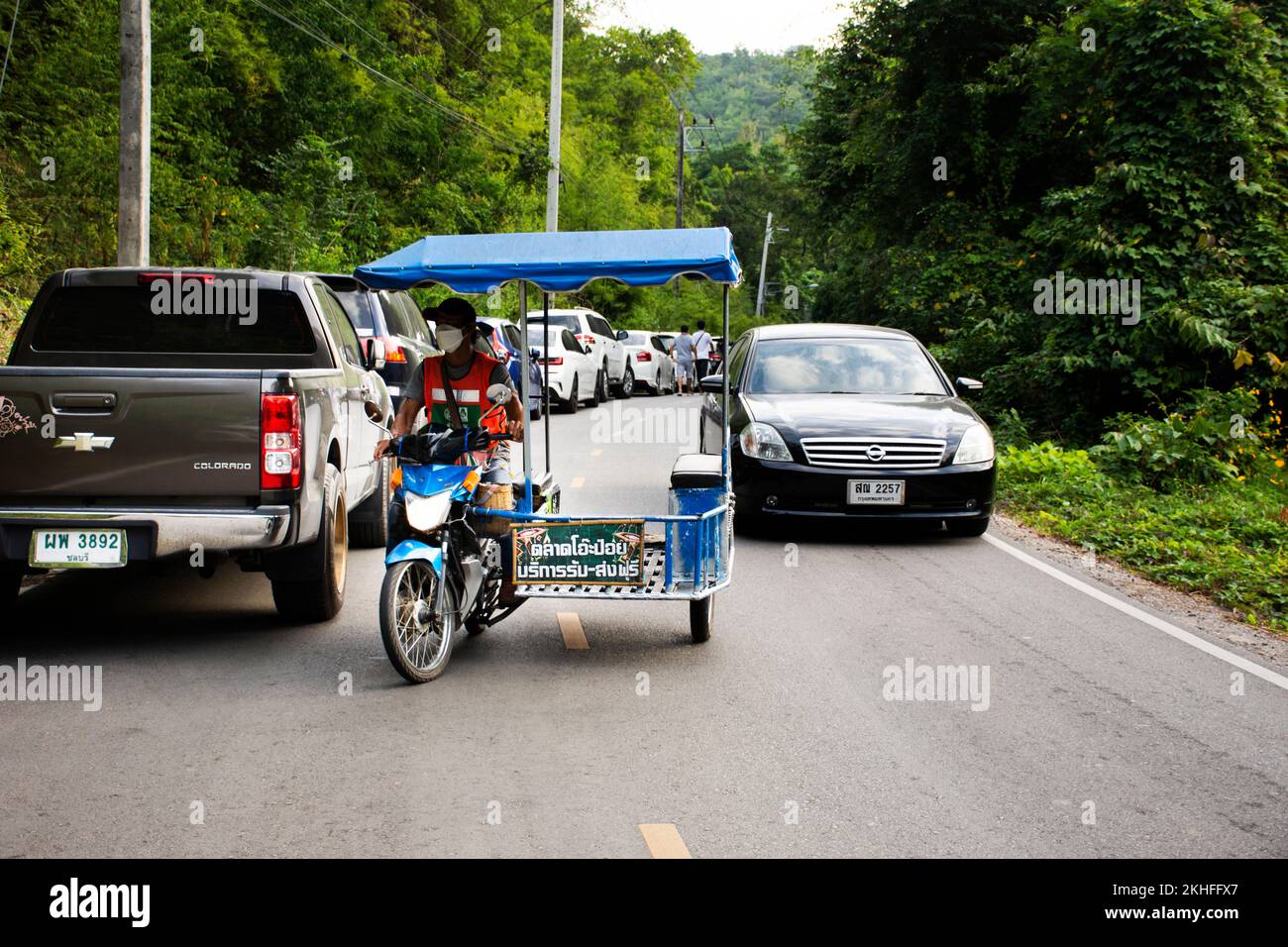 Thai people driver driving tricycle send receive travelers passengers ...