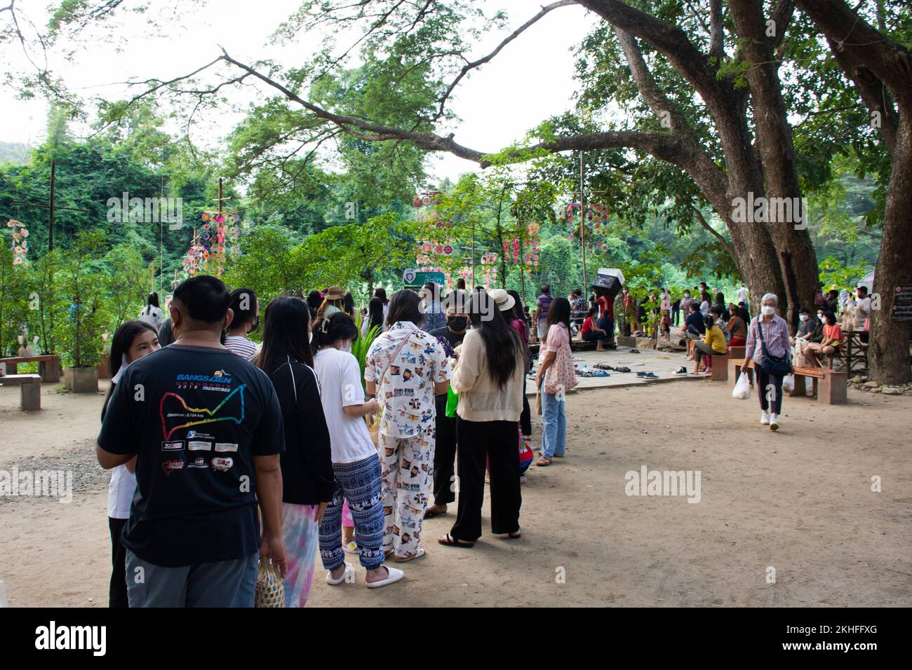 Thai people foreign travelers travel visit waiting join tradition merit ...