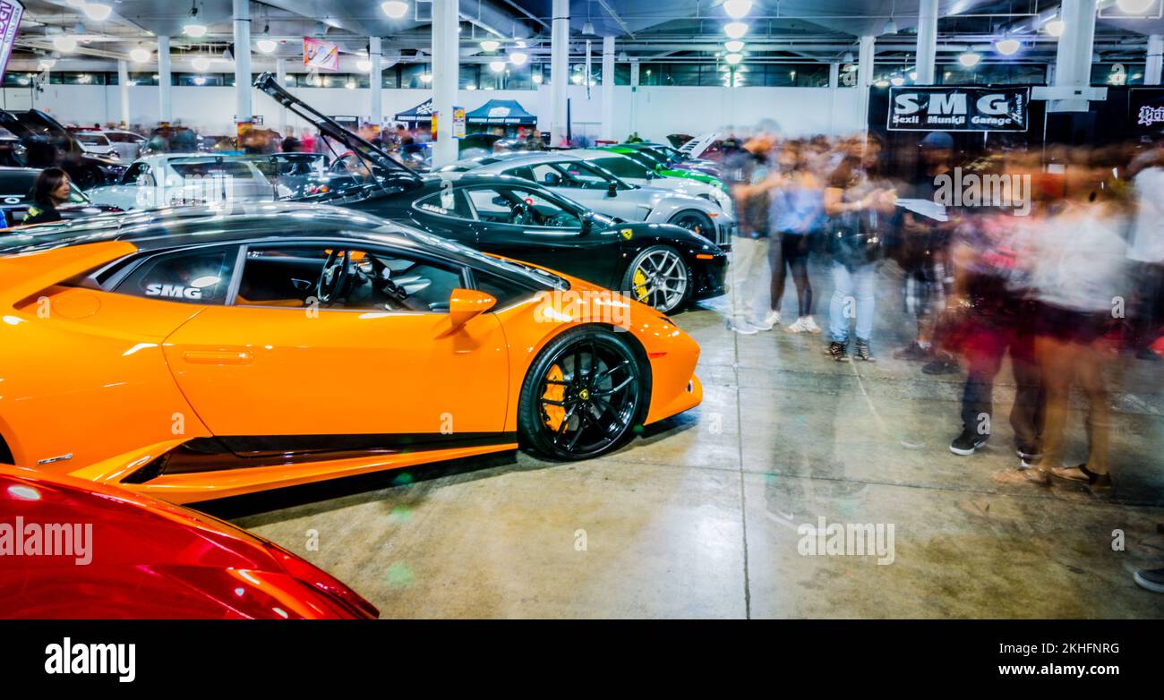 The crowd looking at Lamborghini Huracan in a row with other cars at ...