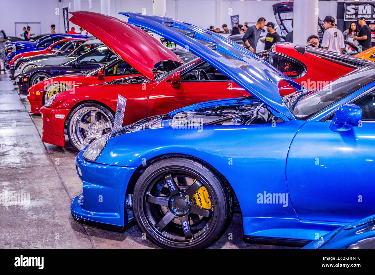 The cars in a row with open hoods at Hot Import Car Show in Honolulu ...