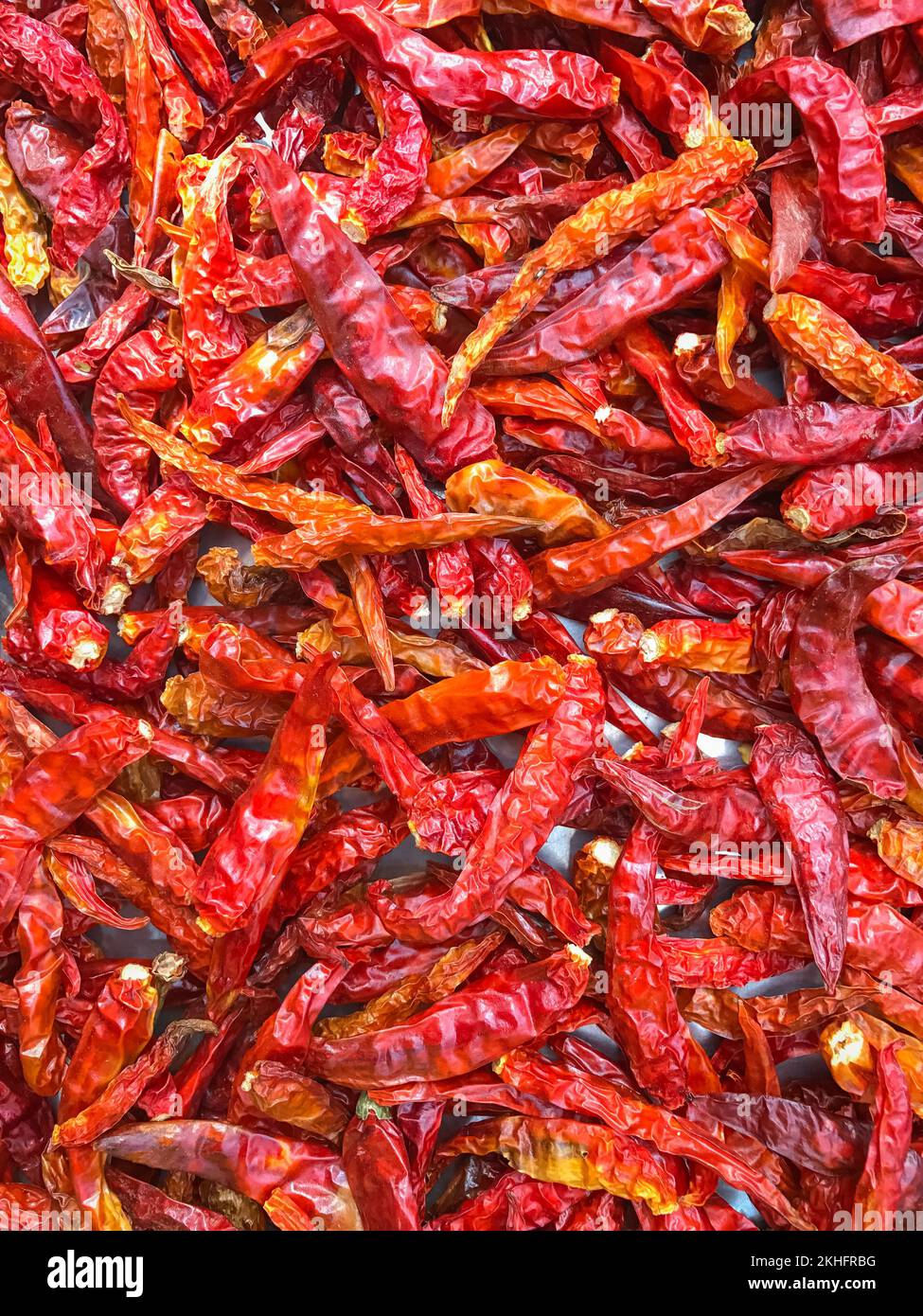Dry red chili pepper background Stock Photo - Alamy