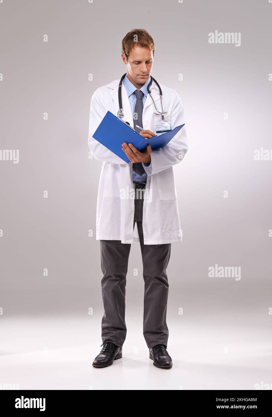 Hes prompt at checking patients test results. Full length shot of a ...