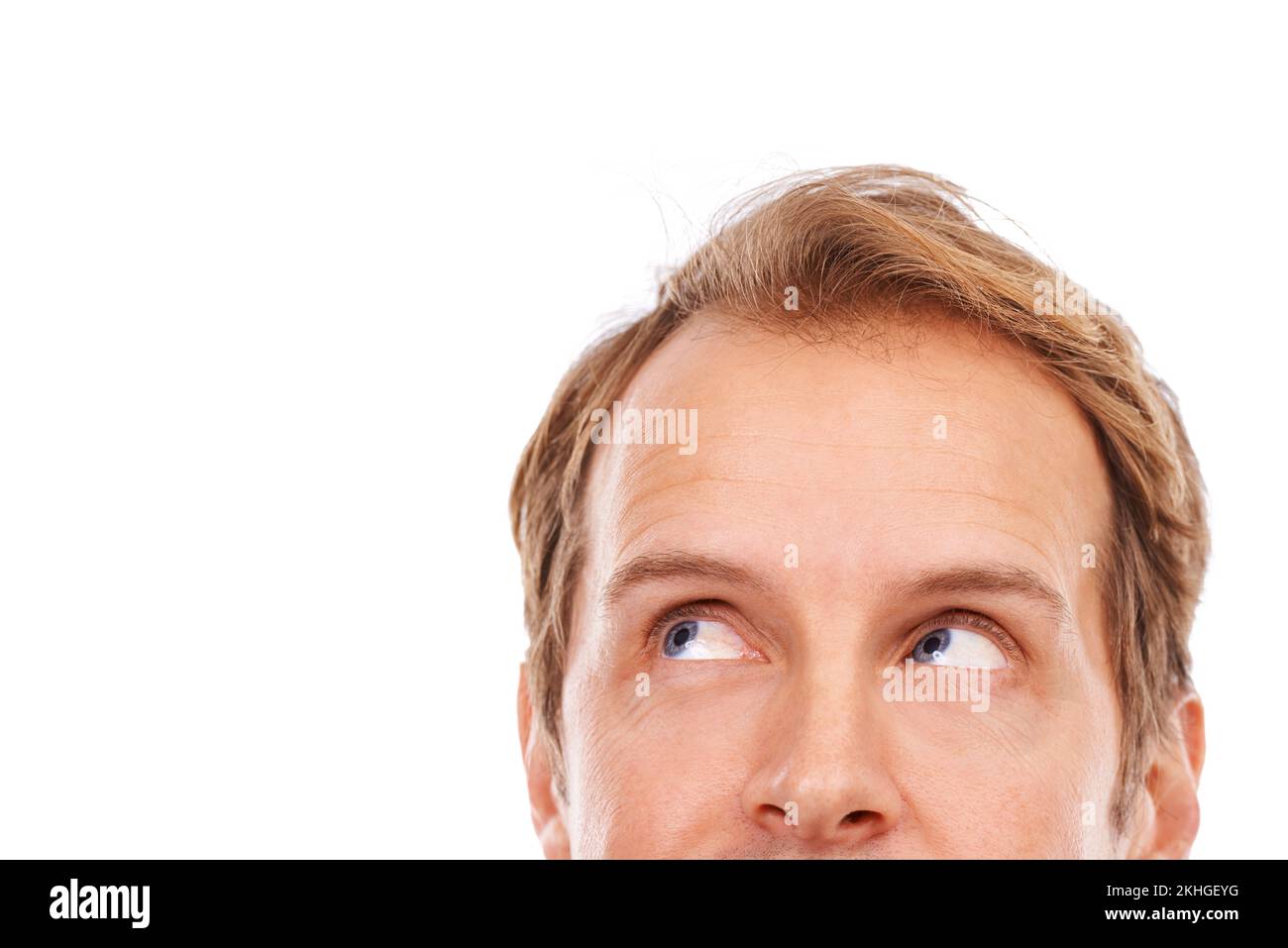 Hmmm... very interesting. the upper half of a young mans face looking ...