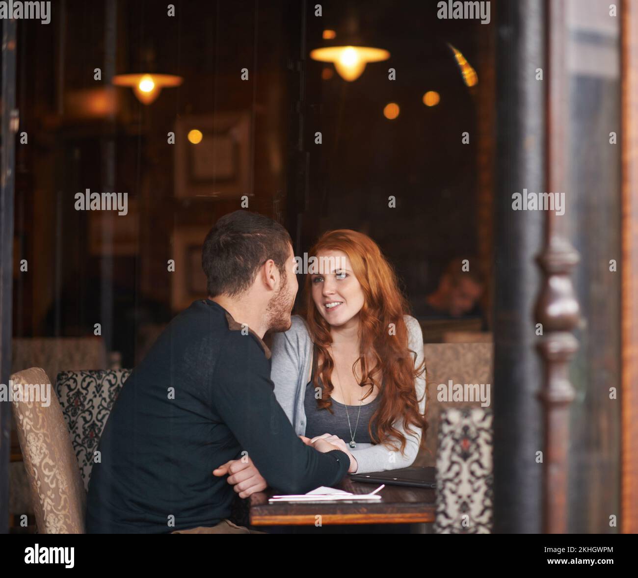 Unaware of anything but each other. a young affectionate couple on a ...