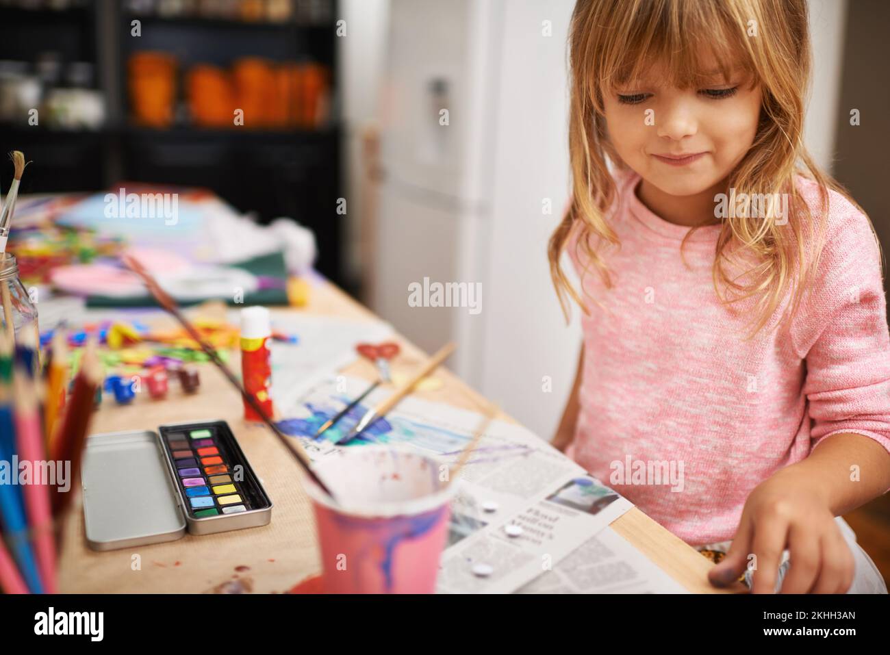 Getting her creativity on. a little girl doing arts and crafts Stock ...