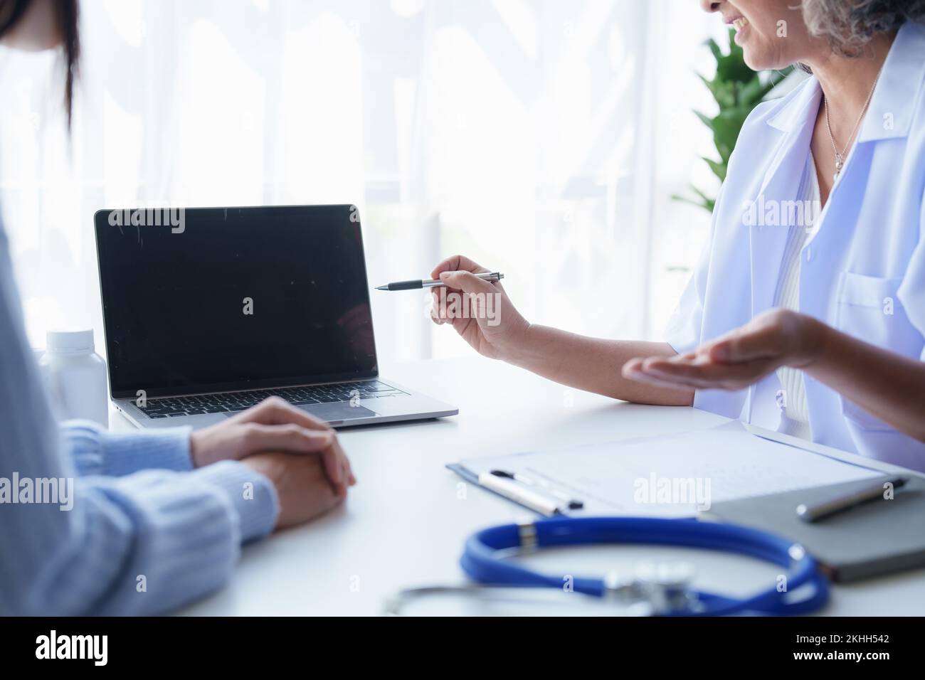 Doctor having conversation with patient while discussing explaining ...