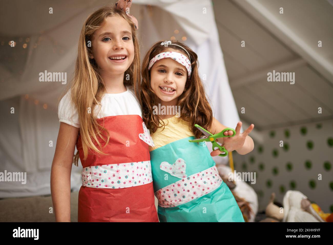 Sisters having fun. two little girls having fun dressing up Stock Photo ...