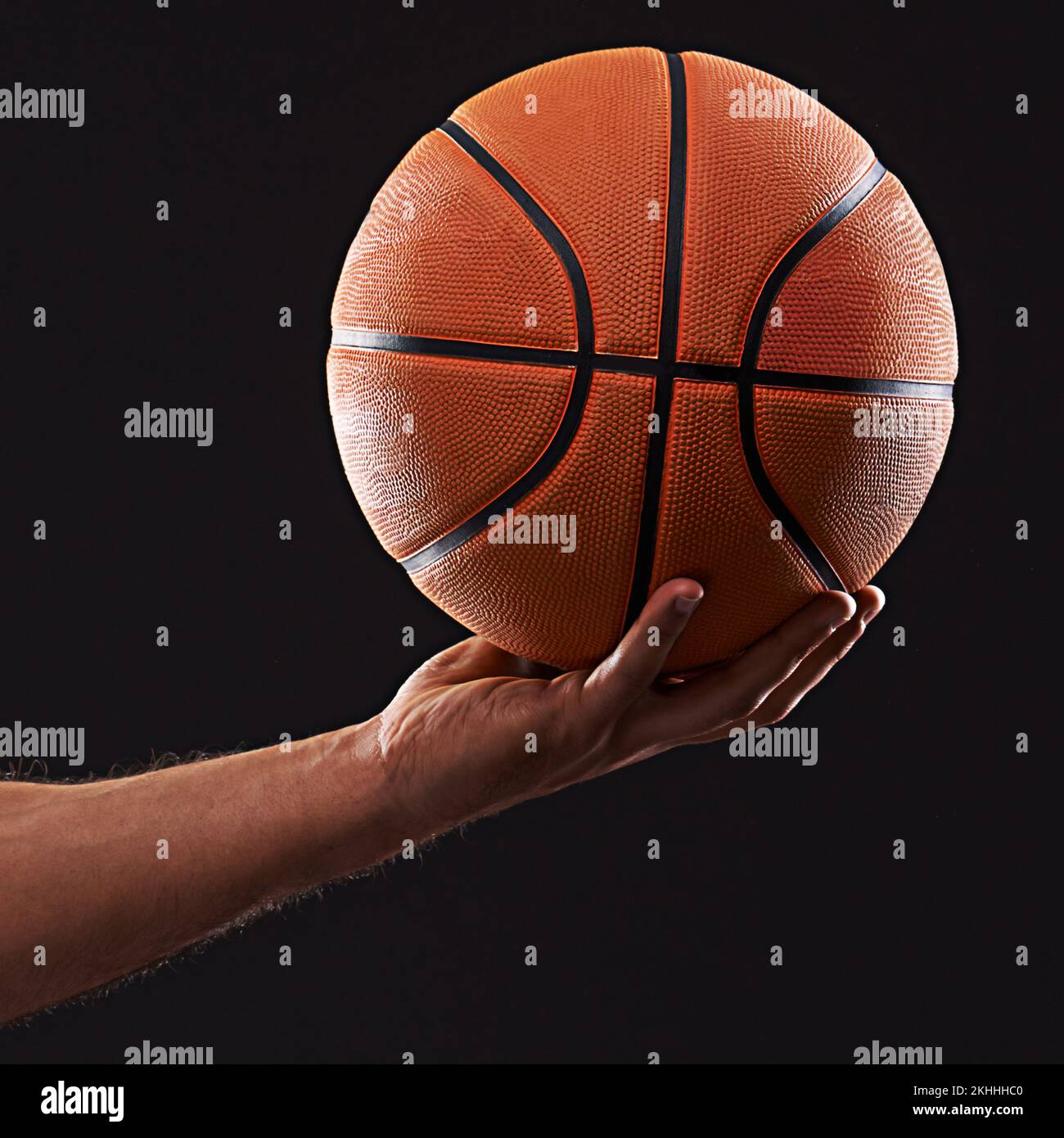 Dont drop the ball. Cropped image of a mans hand holding a basketball ...