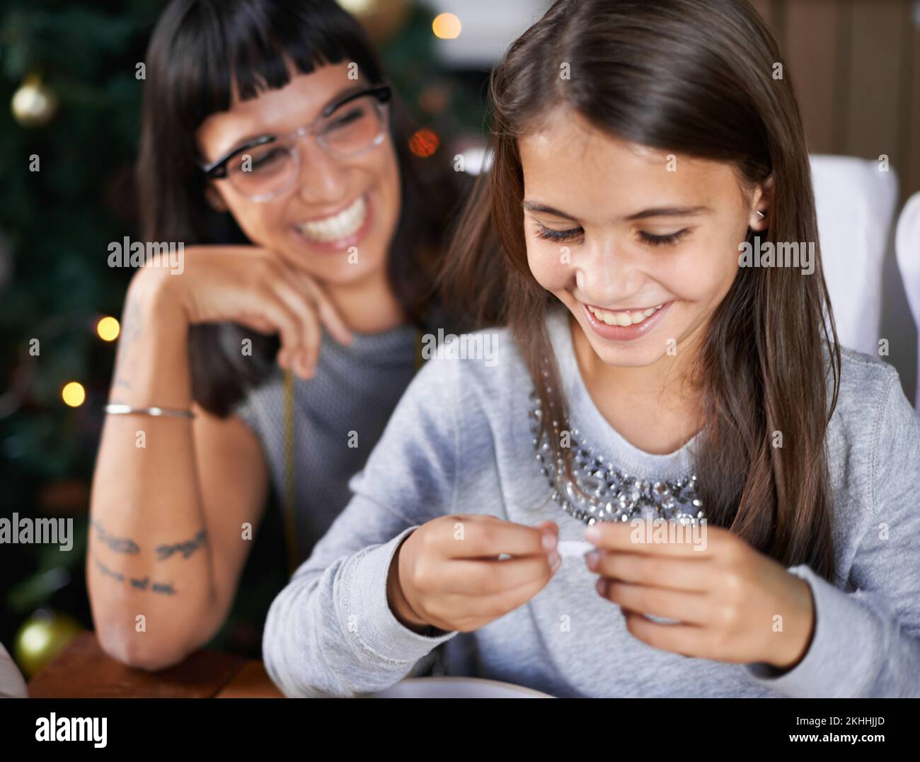 Lets see what this one says. a little girl reading a message from a ...