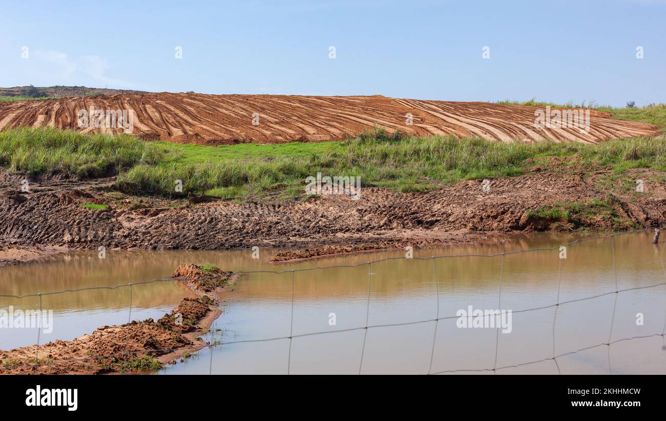 Industrial construction heavy machine moving earth sand on plateau for ...