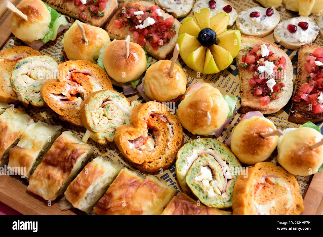 A closeup of appetizing mini snacks on a buffet table during a party ...