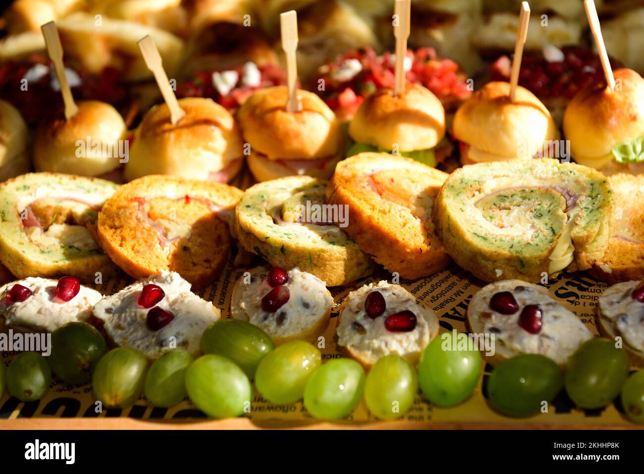 A closeup of appetizing mini snacks on a buffet table during a party ...