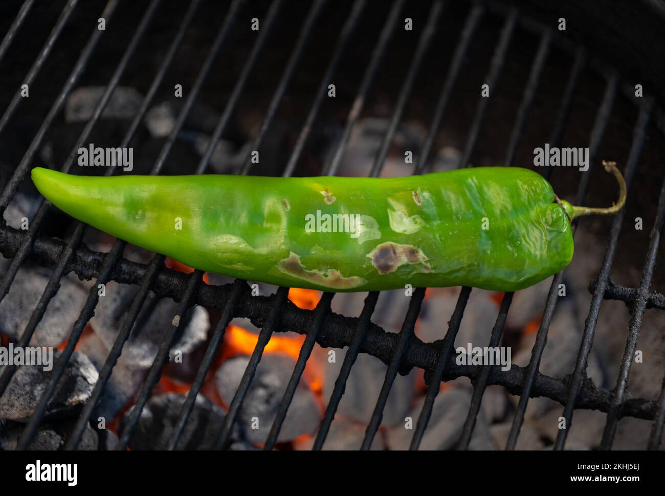A green pepper being cooked on the grill Stock Photo - Alamy