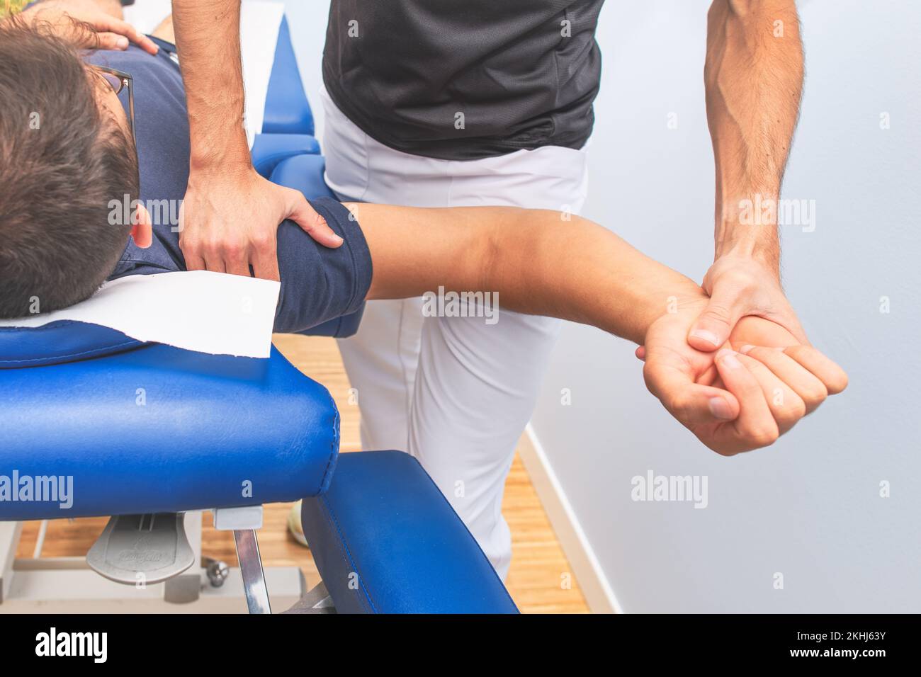 Mobilization of the shoulder by a physical therapist Stock Photo - Alamy