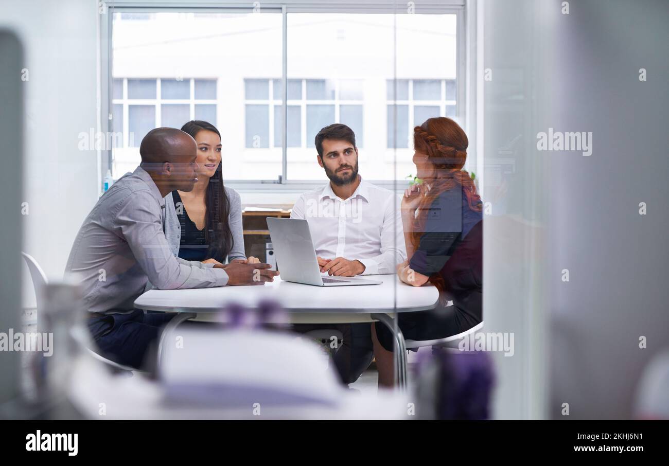 A look behind corporate doors. A group of businesspeople having a ...