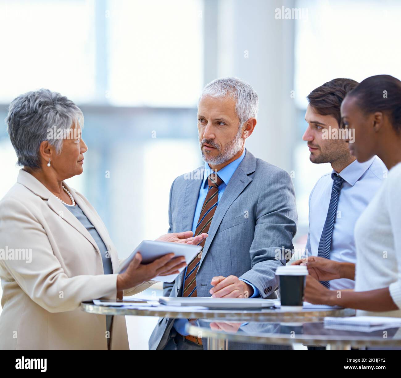 Highlighting their latest business statistics. A mature businesswoman ...