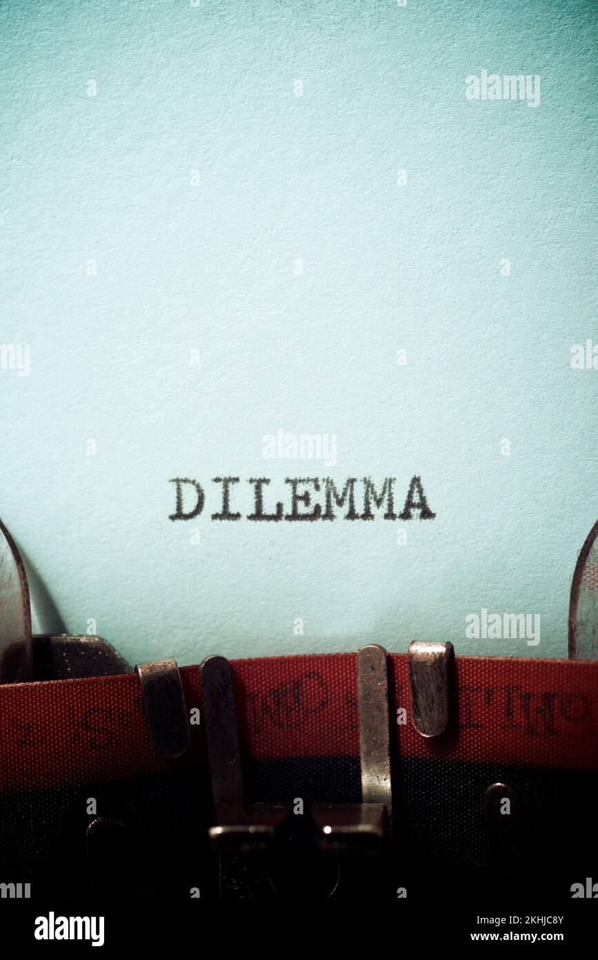 Dilemma word written with a typewriter Stock Photo - Alamy