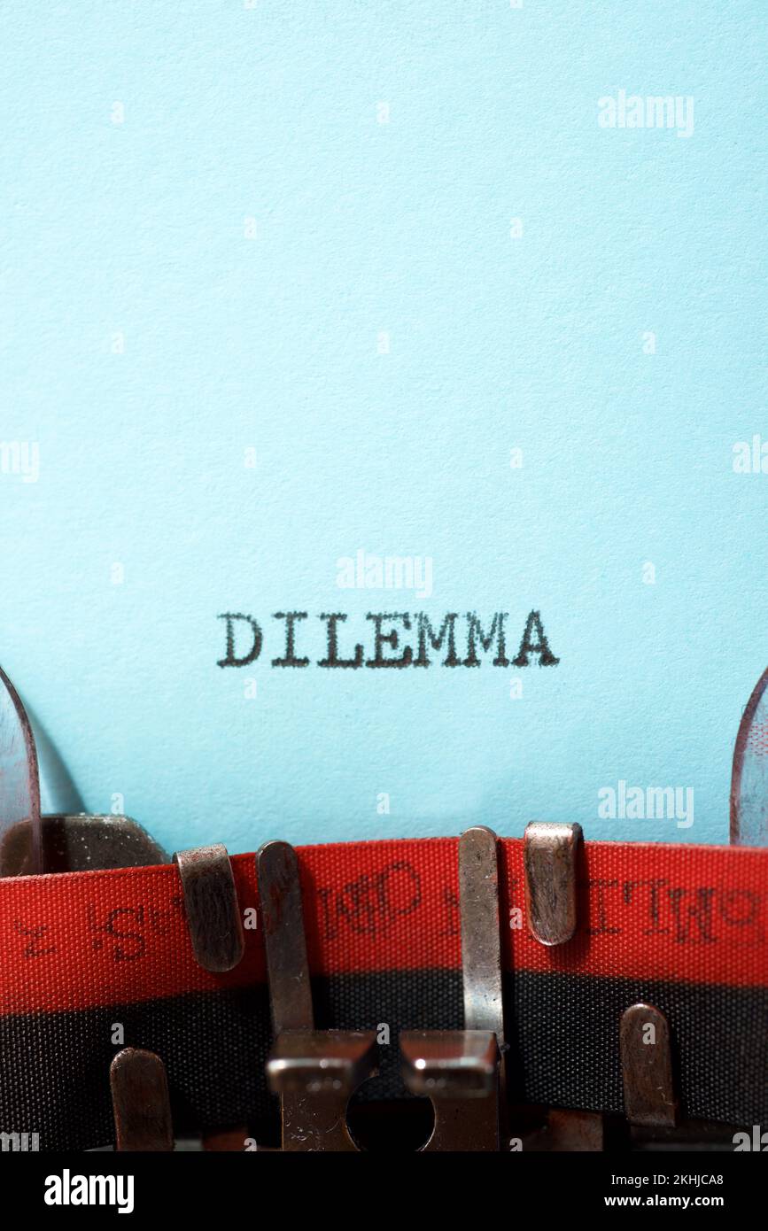 Dilemma word written with a typewriter Stock Photo - Alamy