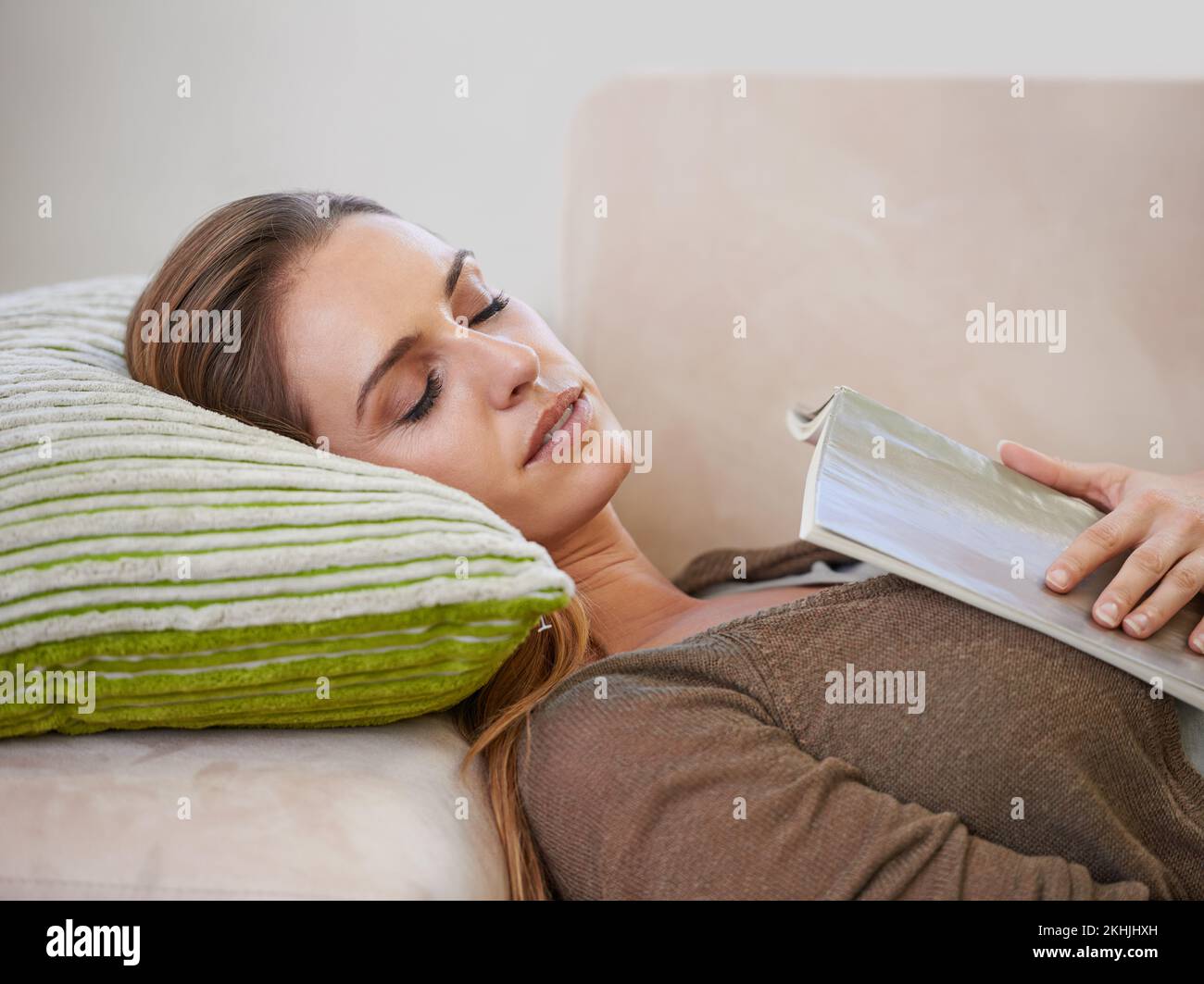 Taking this book into dreamworld. an attractive woman napping on the ...
