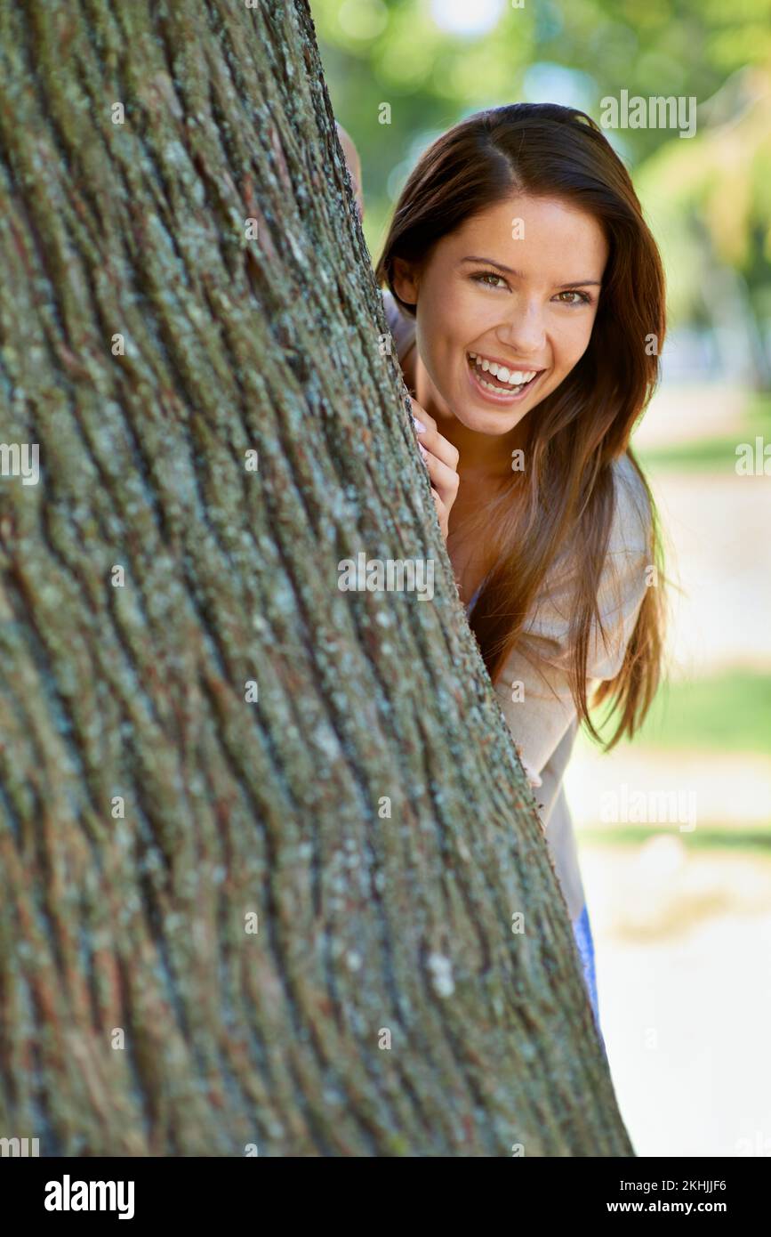 Woman standing at tree hi-res stock photography and images - Alamy