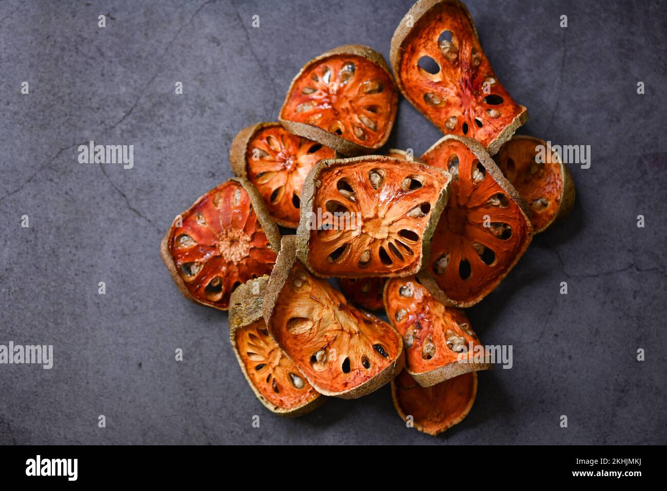 Dried bael slices on dark background, Bael for bael juice - Dry bael ...