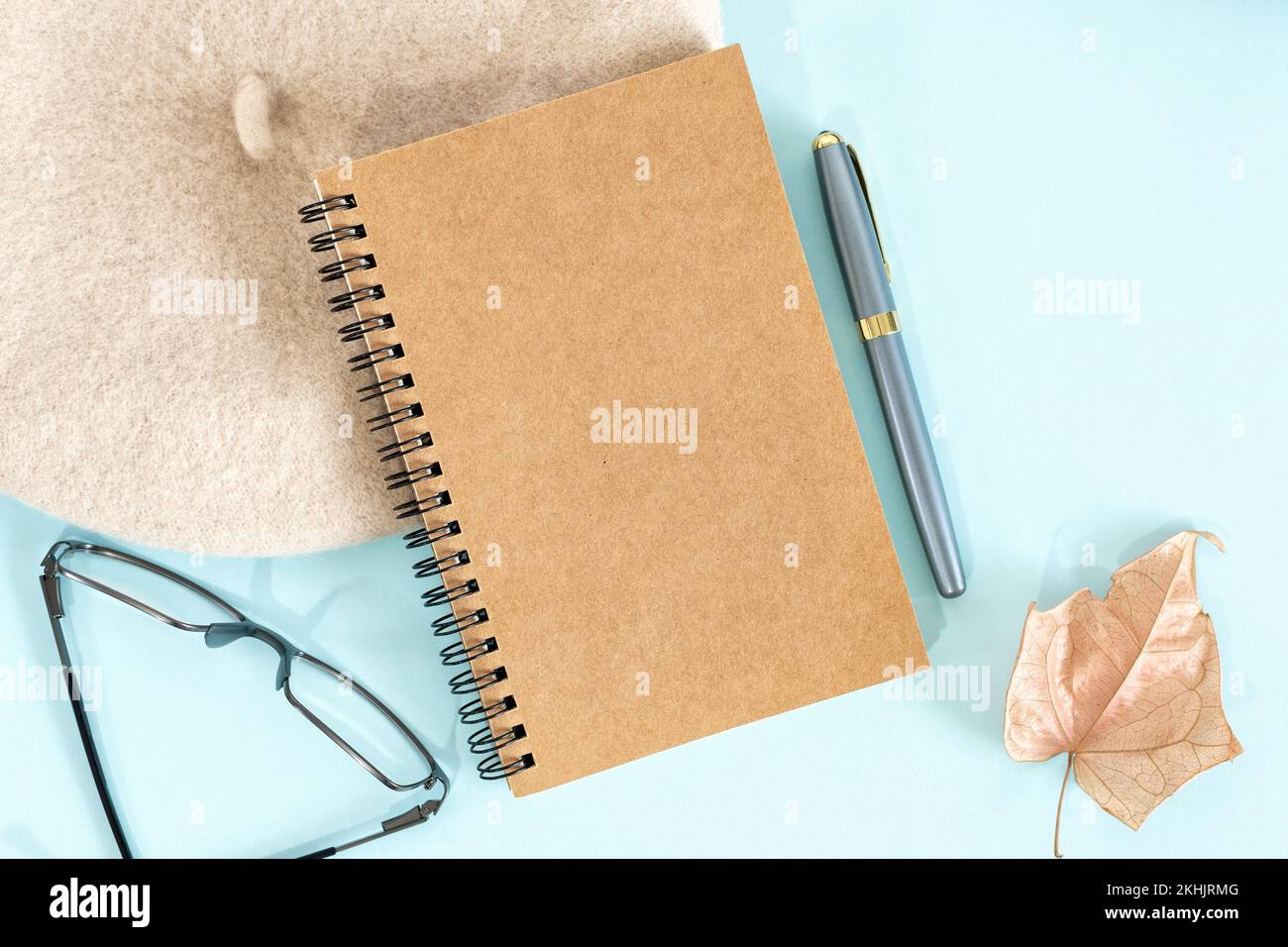 A top view of a pen and notepad on the office table Stock Photo - Alamy