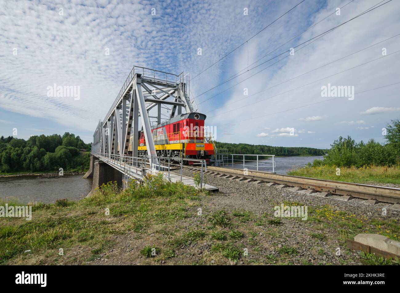 Red Russian Railways train on the bridge. beautiful iron bridge Stock ...