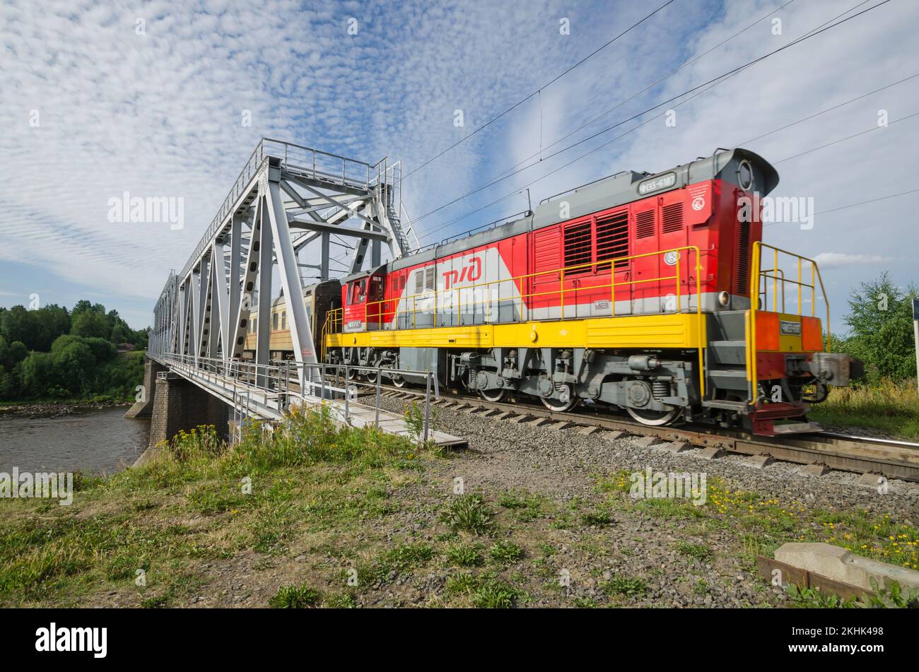 Red Russian Railways train on the bridge. beautiful iron bridge Stock ...