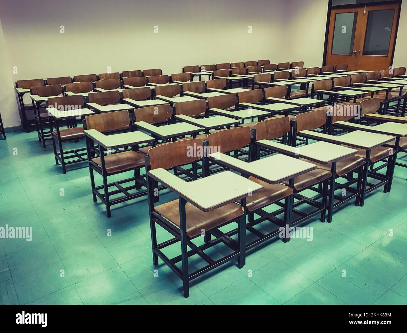 Wooden chairs in the classroom background Stock Photo - Alamy