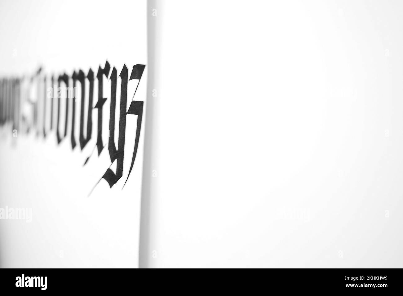 Alphabet letters handwritten in black ink on a white background. Gothic ...