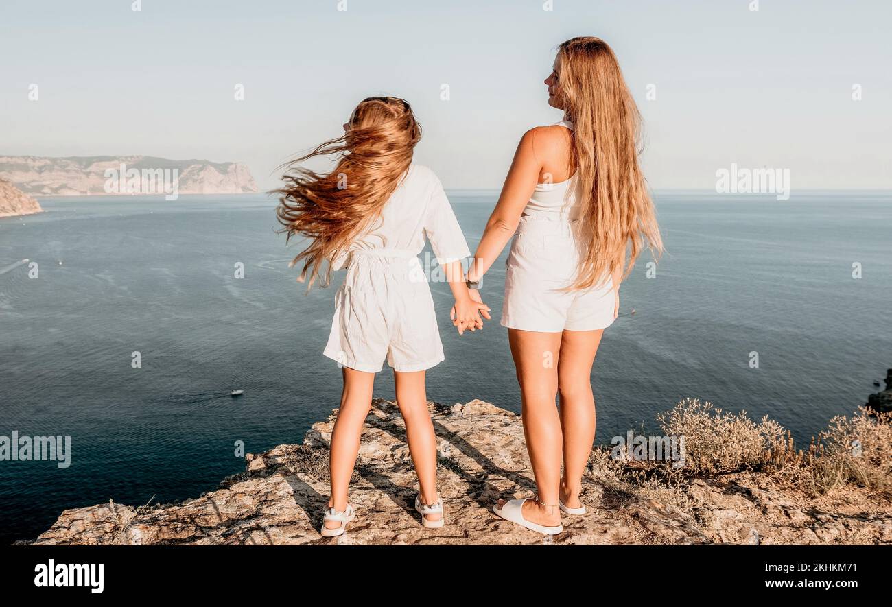 Sea family vacation together, happy mom and teenage daughter hugging ...