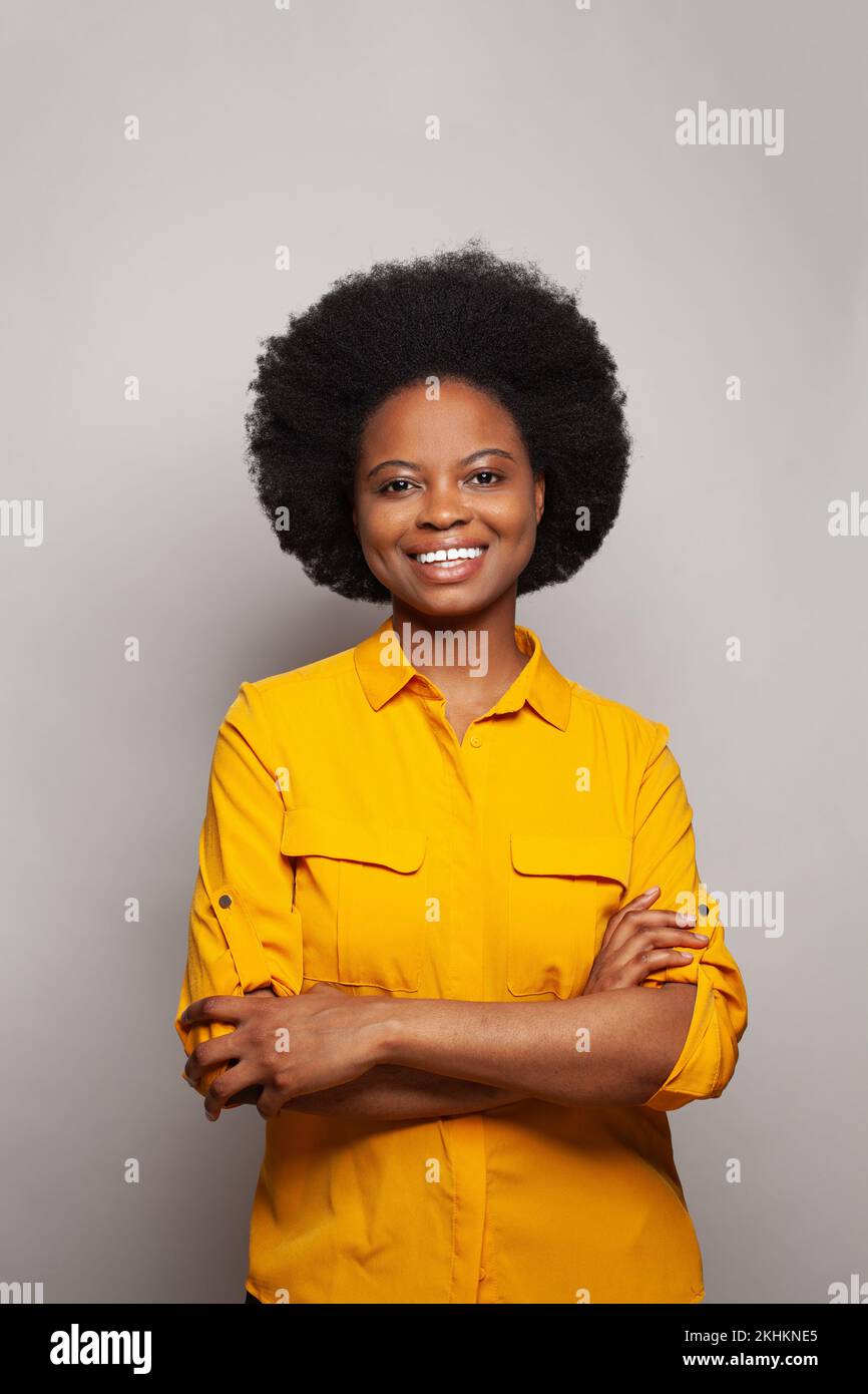 Friendly cheerful attractive african american young 25s woman smiling ...