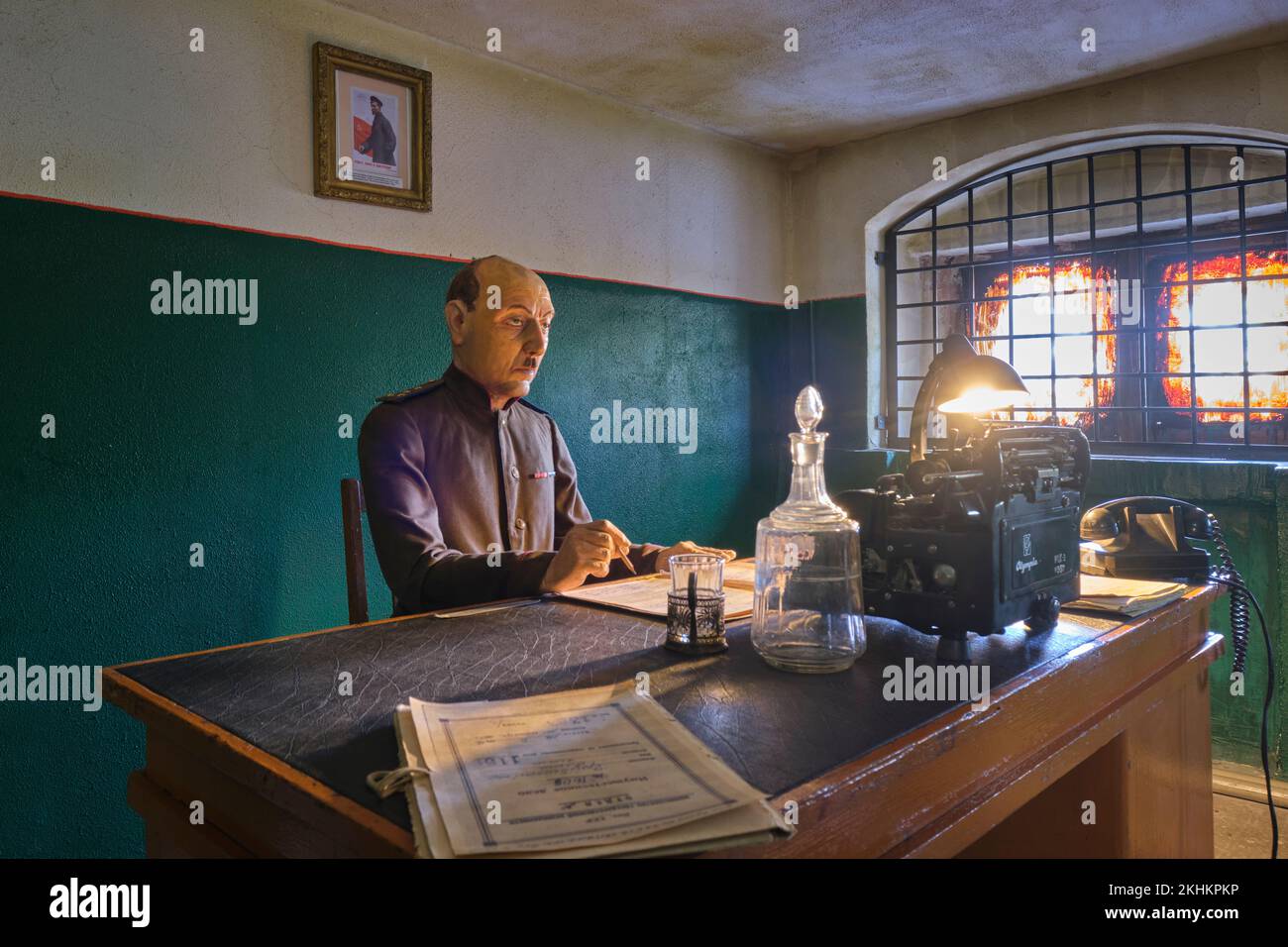 Recreation of a guard, officer, sitting at his desk at the work, labor ...