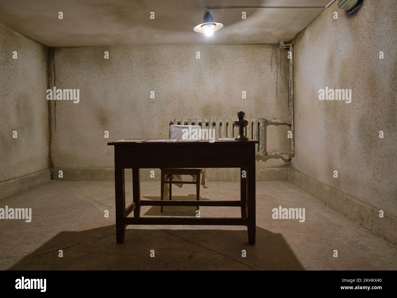 Recreation of a wood desk and chair, prepped for a prisoner ...