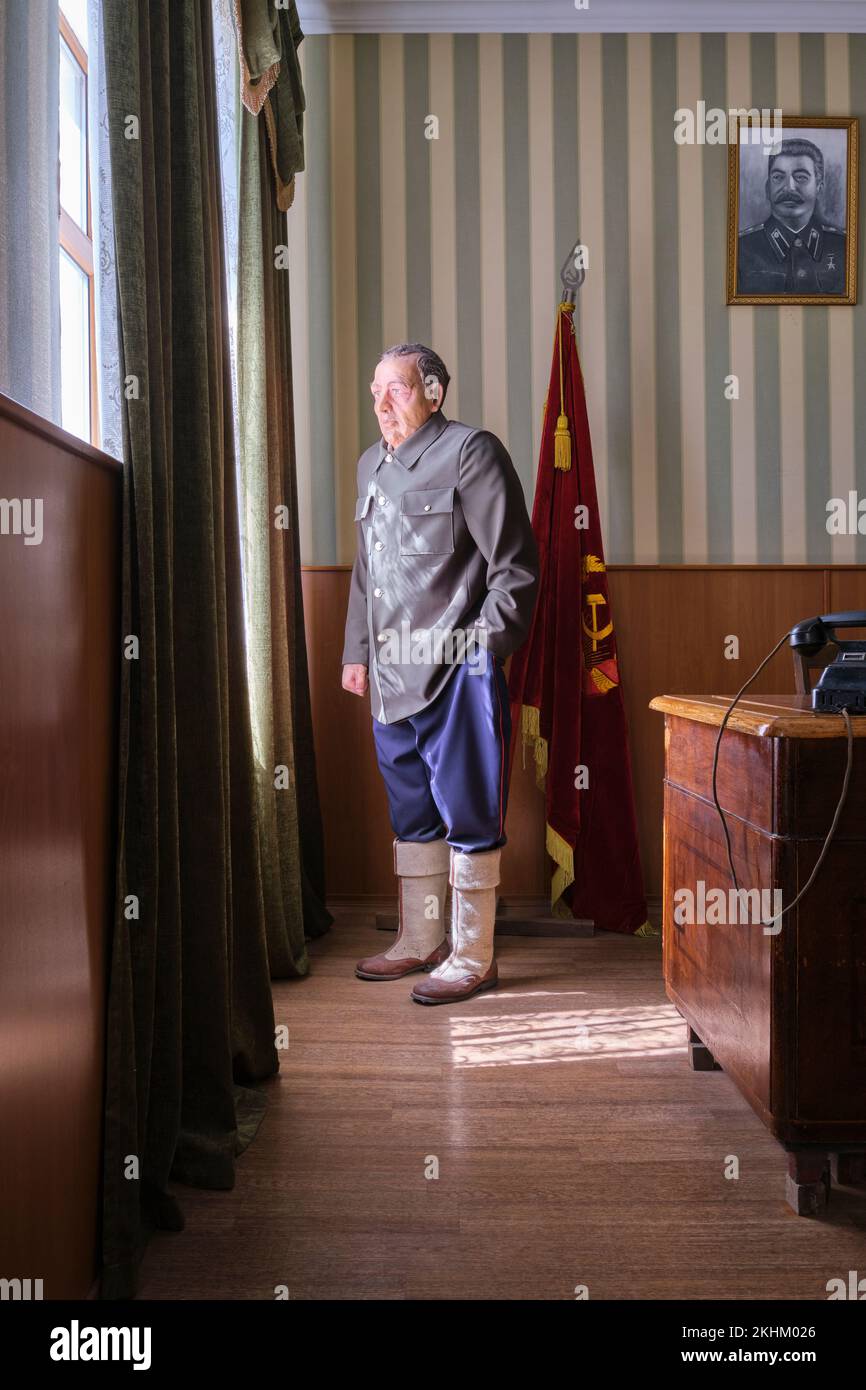Recreation of the uniformed head warden in his office, looking out a ...