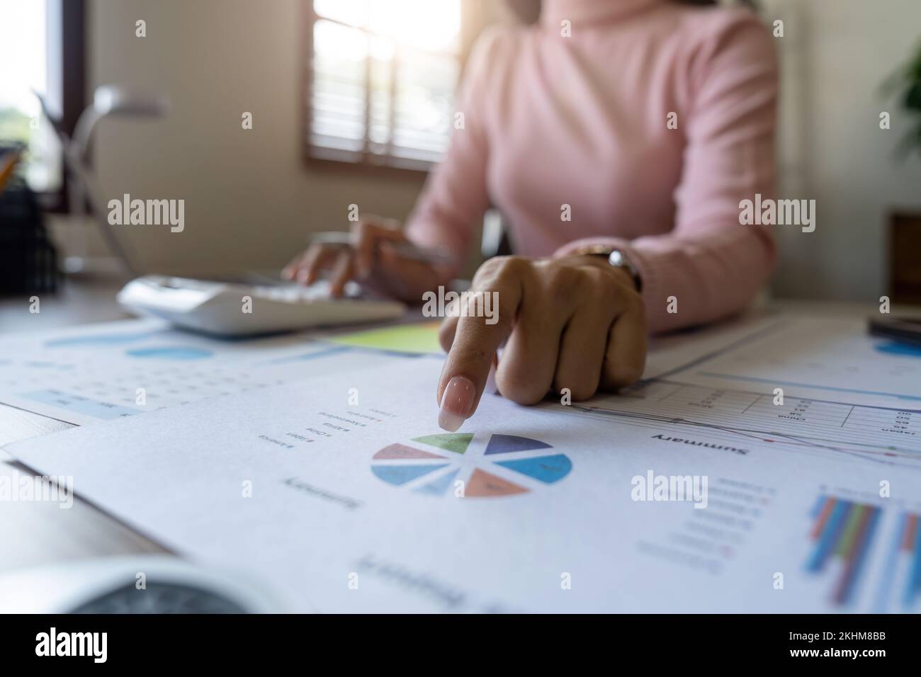 Woman accountant working with calculator for business and financial ...