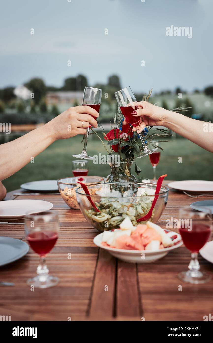 Couple holding hands dinner table hi-res stock photography and images ...