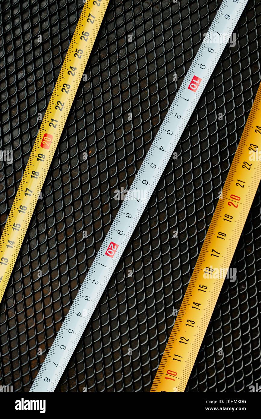 Steel tape measure. Measuring tool on metal surface. Technical ...