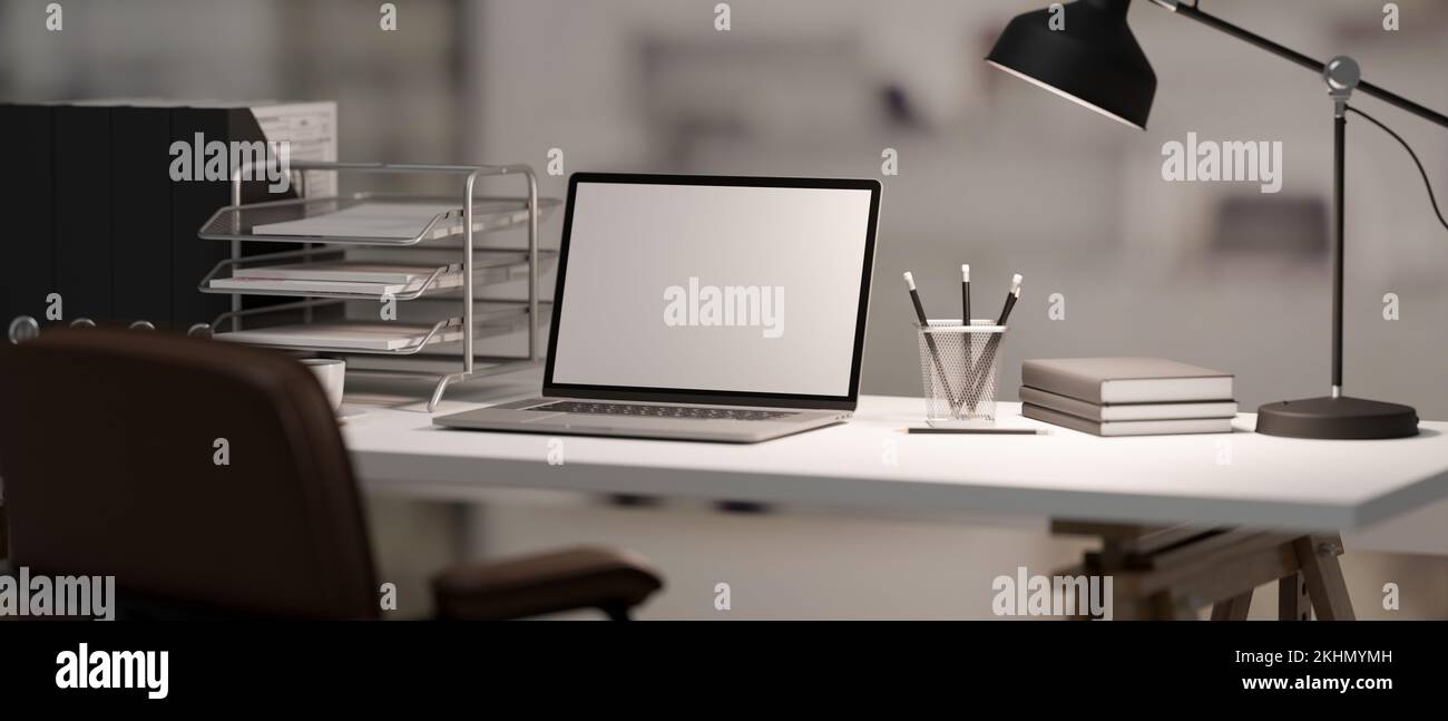 Modern office desk with laptop white screen mockup, table lamp, office ...