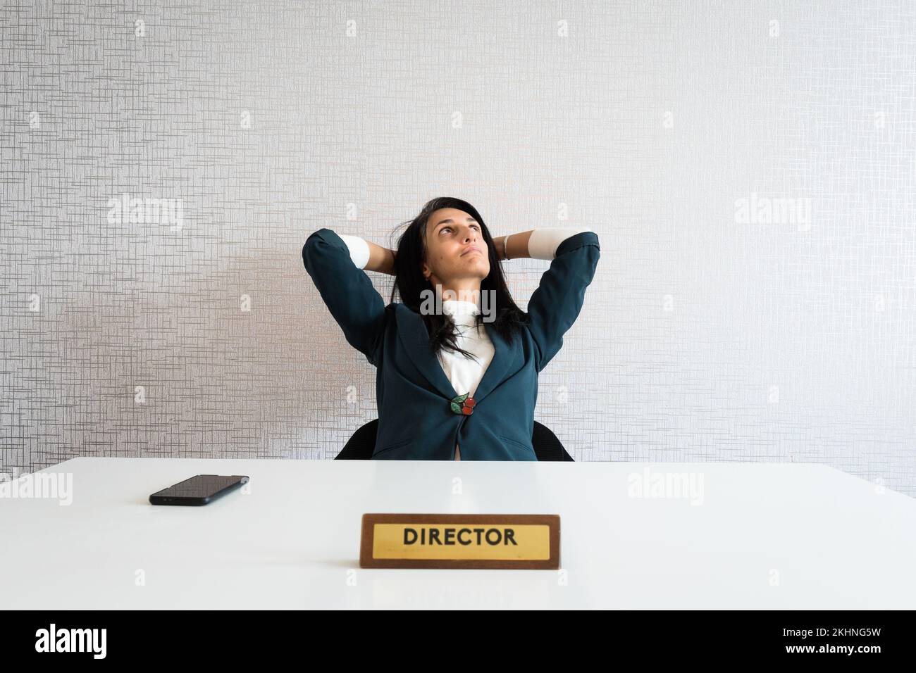 Young caucasian brunette business woman director in office lay back at ...