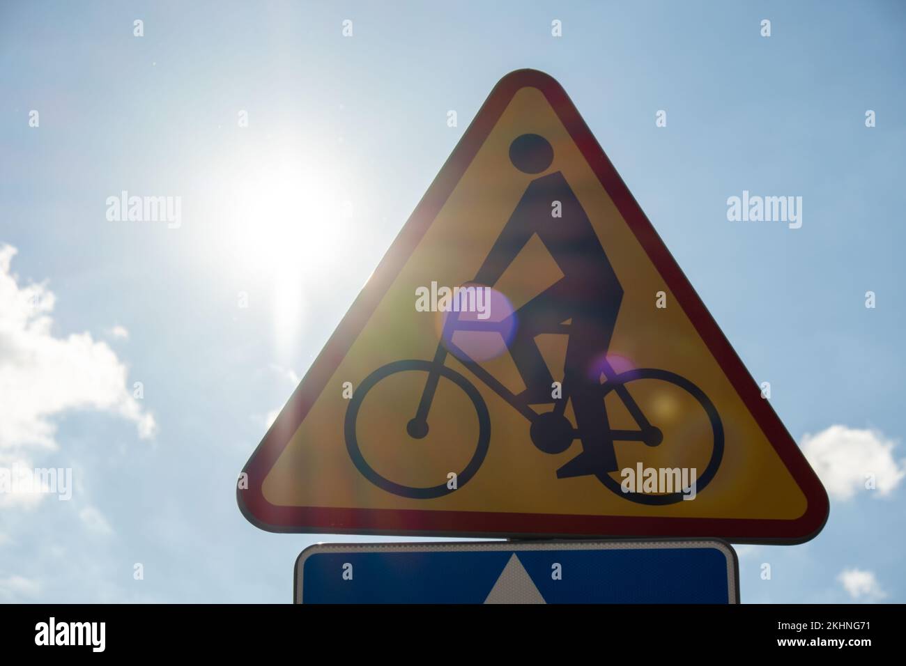 Triangle bicycle sign transit prohibited for bicycles on blurred park ...