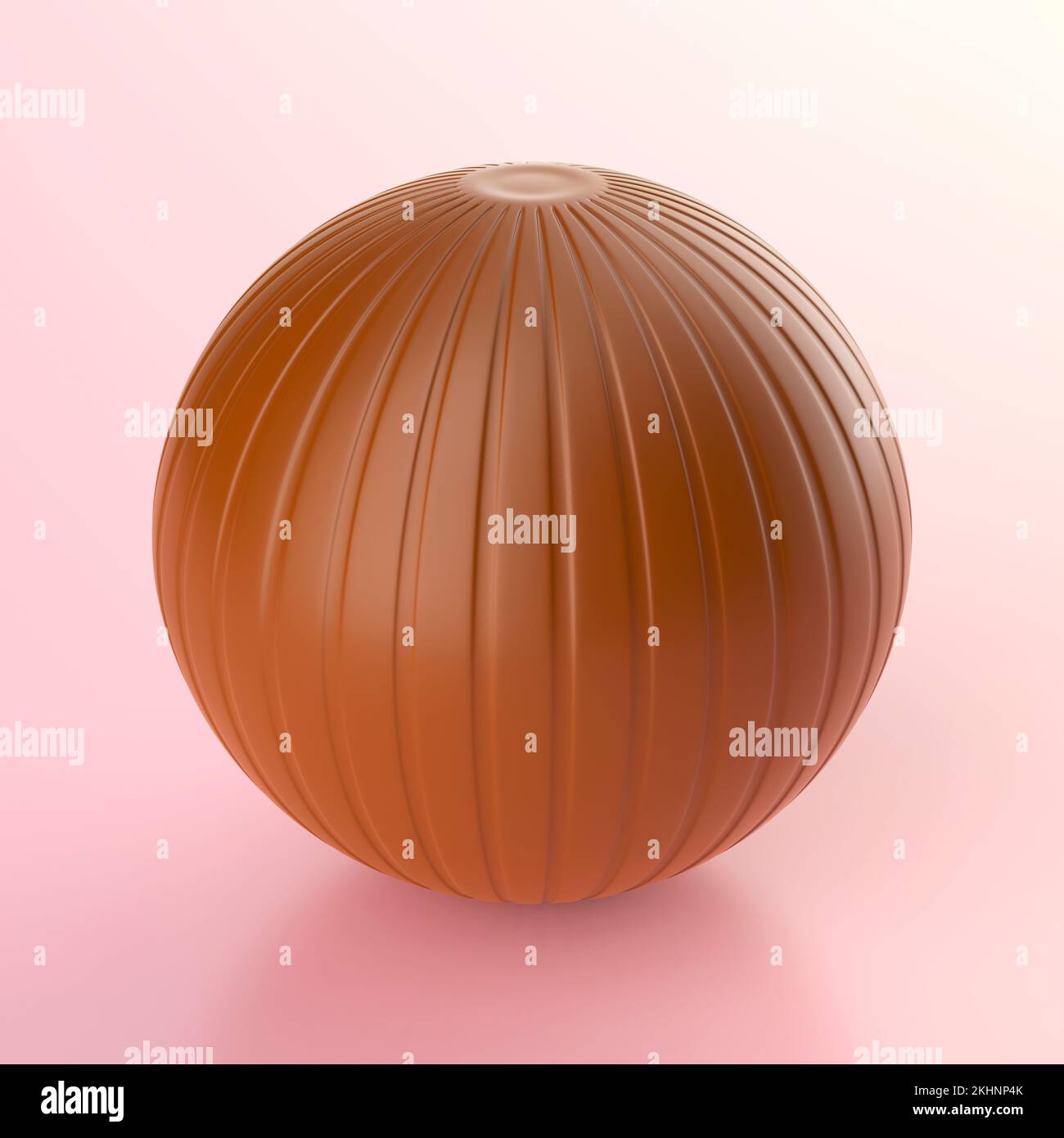 Chocolate ball on pink background Stock Photo - Alamy