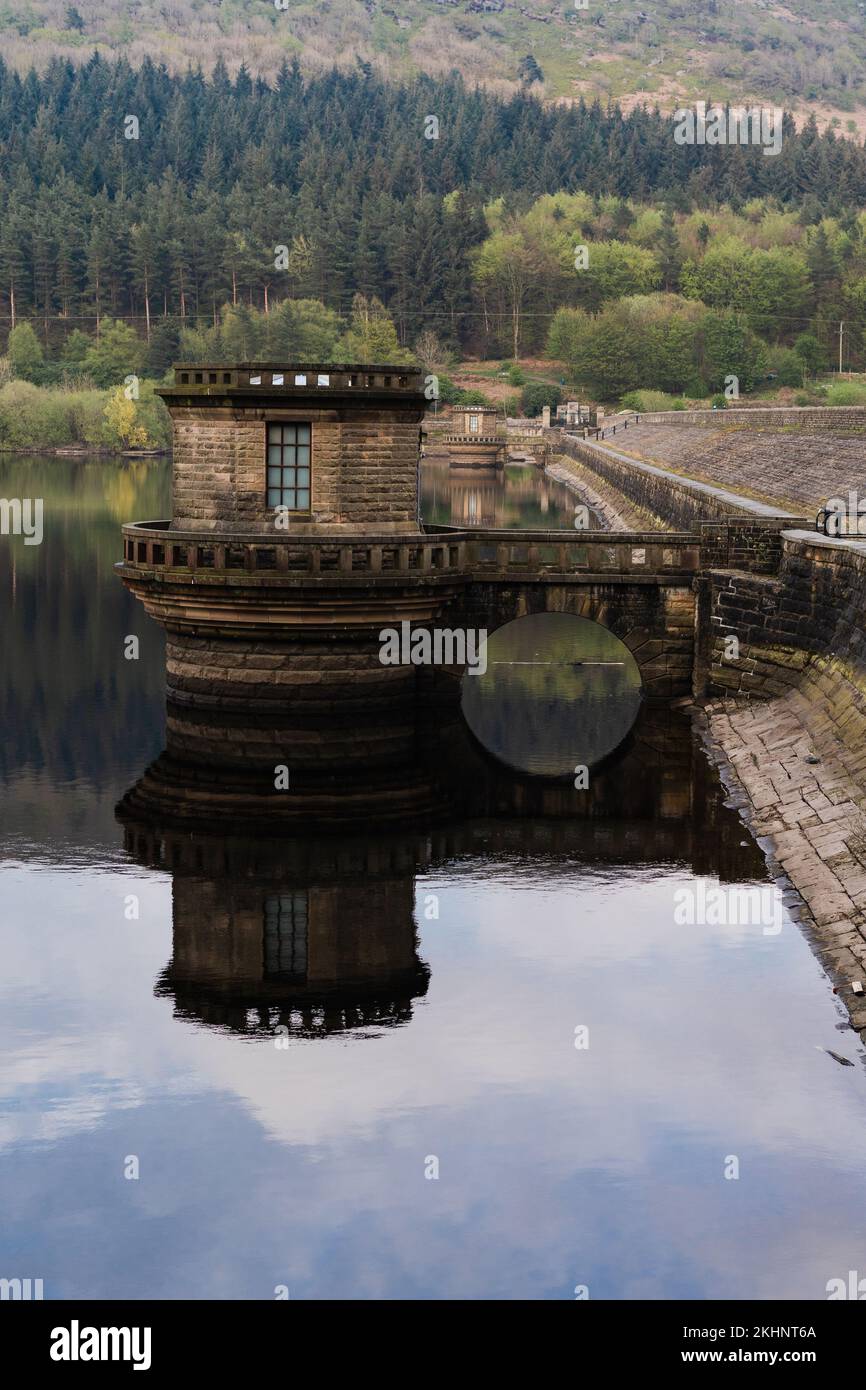 A vertical shot of the stone wall of Lady Bower Reservoir. Peak ...