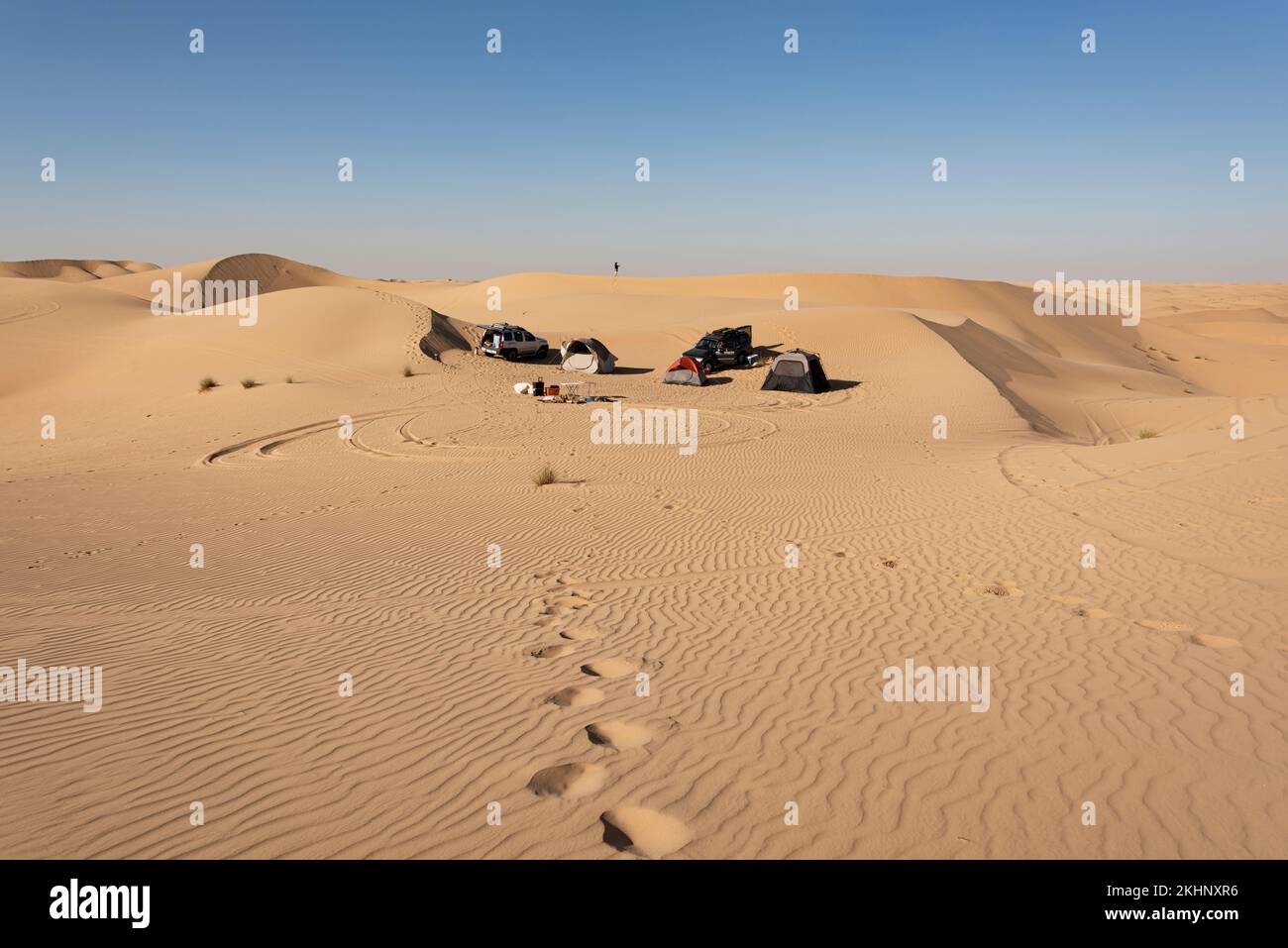 Friends camping in the desert of the United Arab Emirates, camp in sand ...