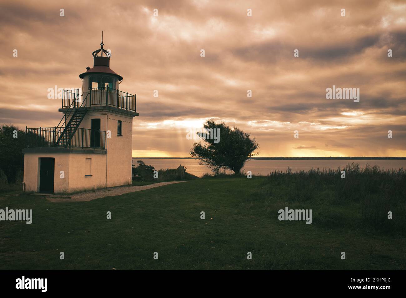 Lighthouse, Spodsbjerg Fyr in Huntsted on the coast of Denmark. Sun ...