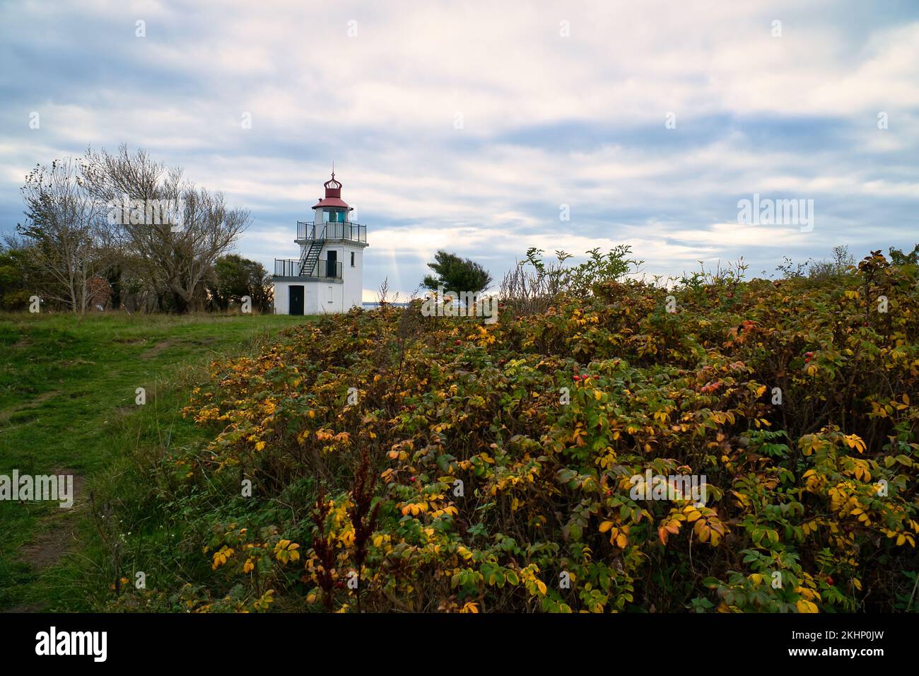 Lighthouse, Spodsbjerg Fyr in Huntsted on the coast of Denmark. Sun ...
