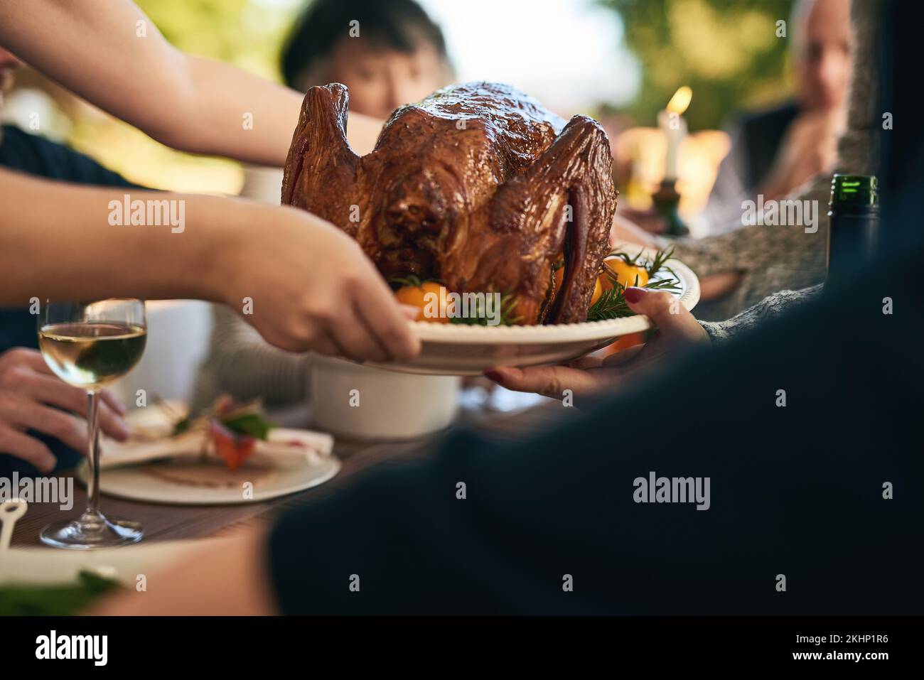 Thanksgiving, food and party with a roast chicken on a table during a ...