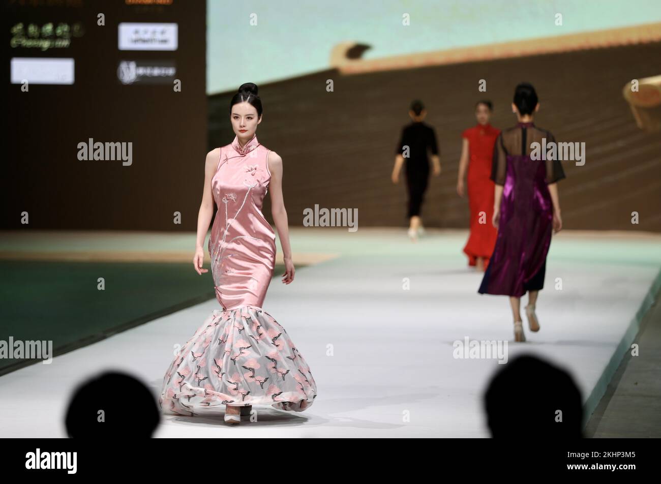 Models wearing cheongsam displayed on the catwalk at the Closing ...