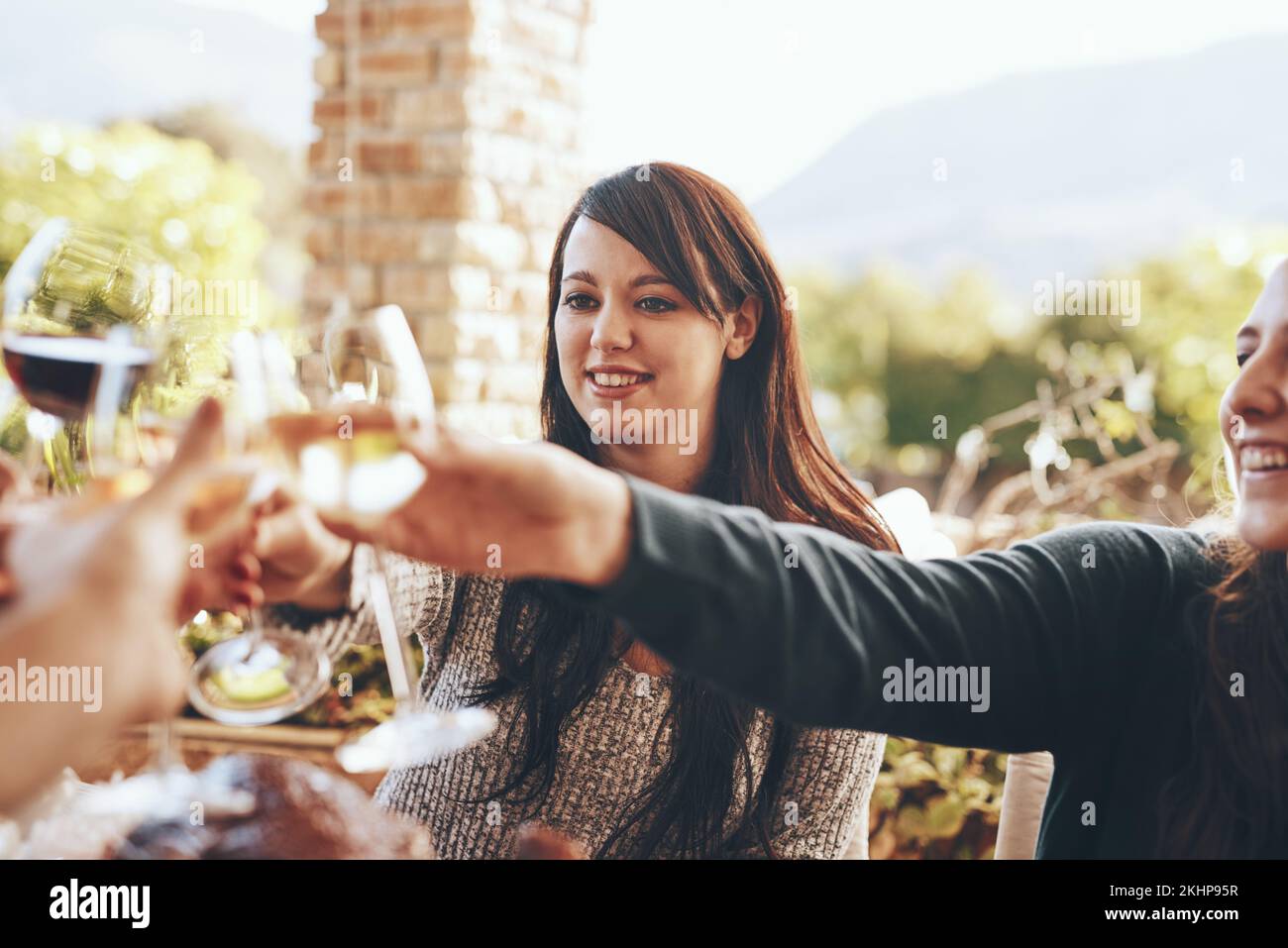 Sitting toast holding celebration food and drink glass hi-res stock ...
