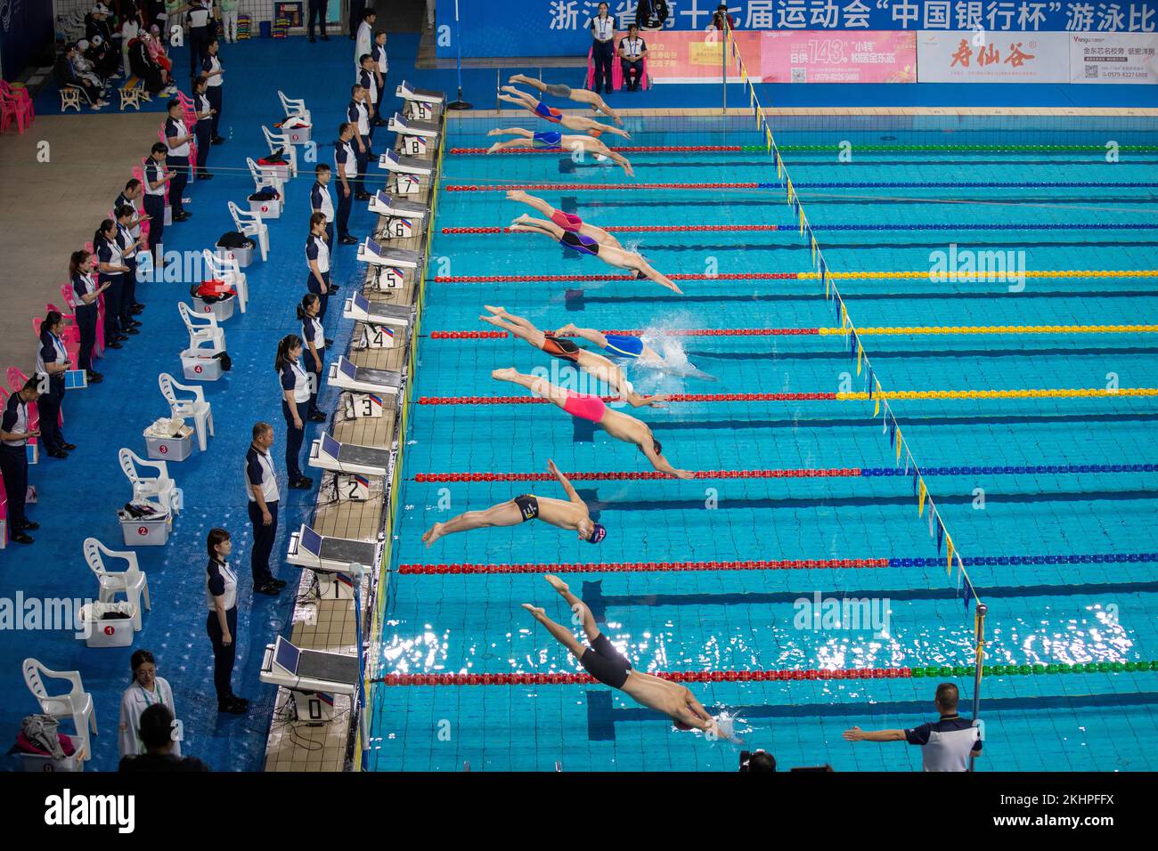 The athletes are competing at the Swimming Contest of the 17th Games of ...